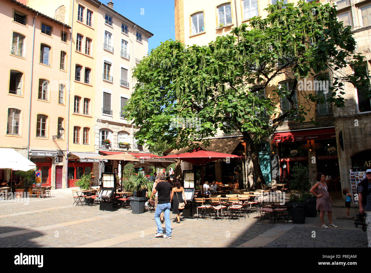 Lovely café underneath a tree in the old city of Lyon, France Stock ...
