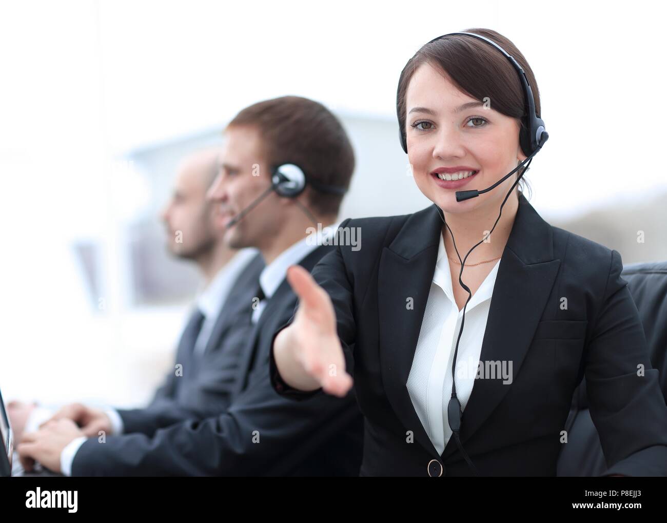 Manager of call center reaches out to shake hands Stock Photo - Alamy