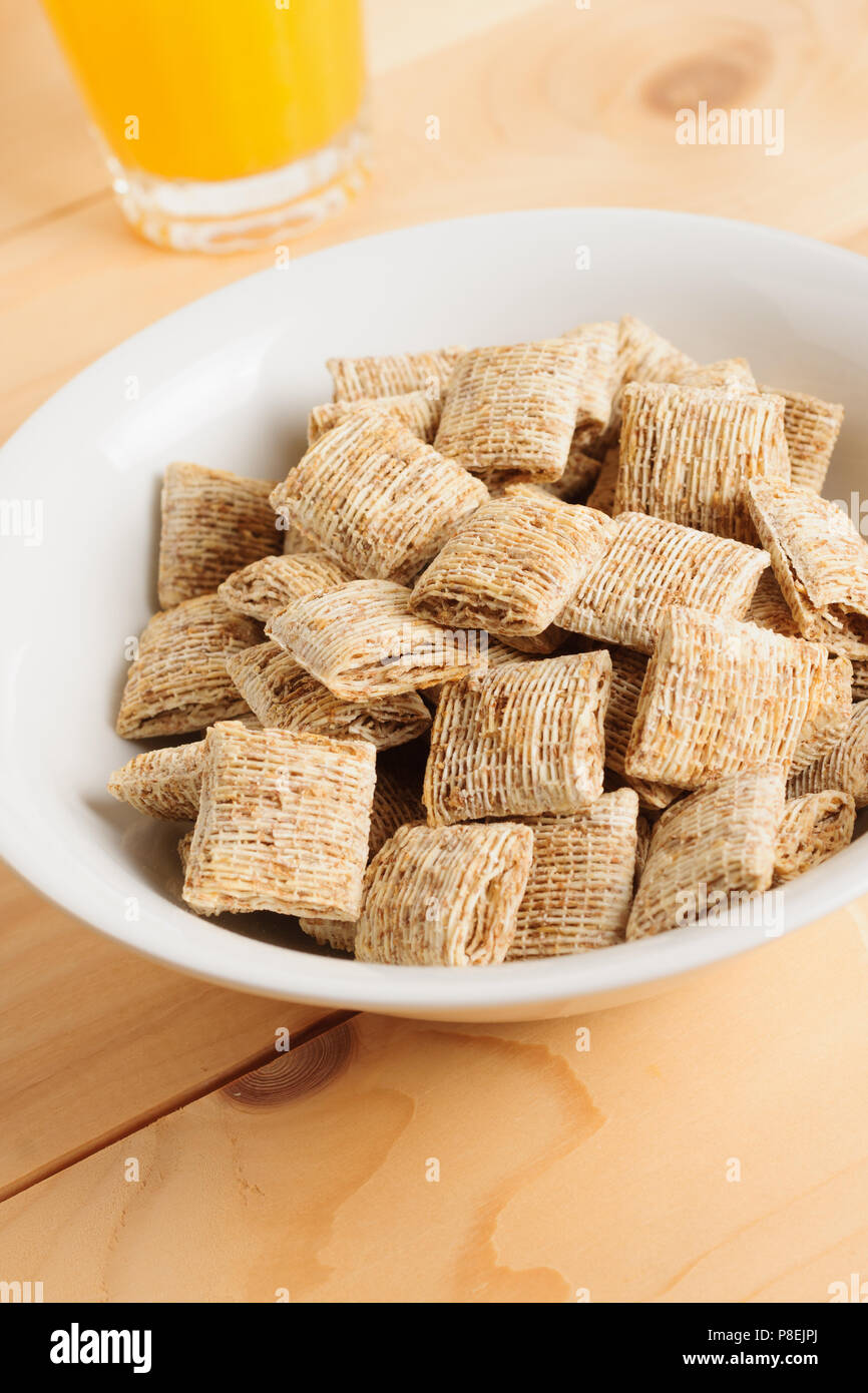 Healthy bite size wholewheat breakfast cereal biscuits with orange ...