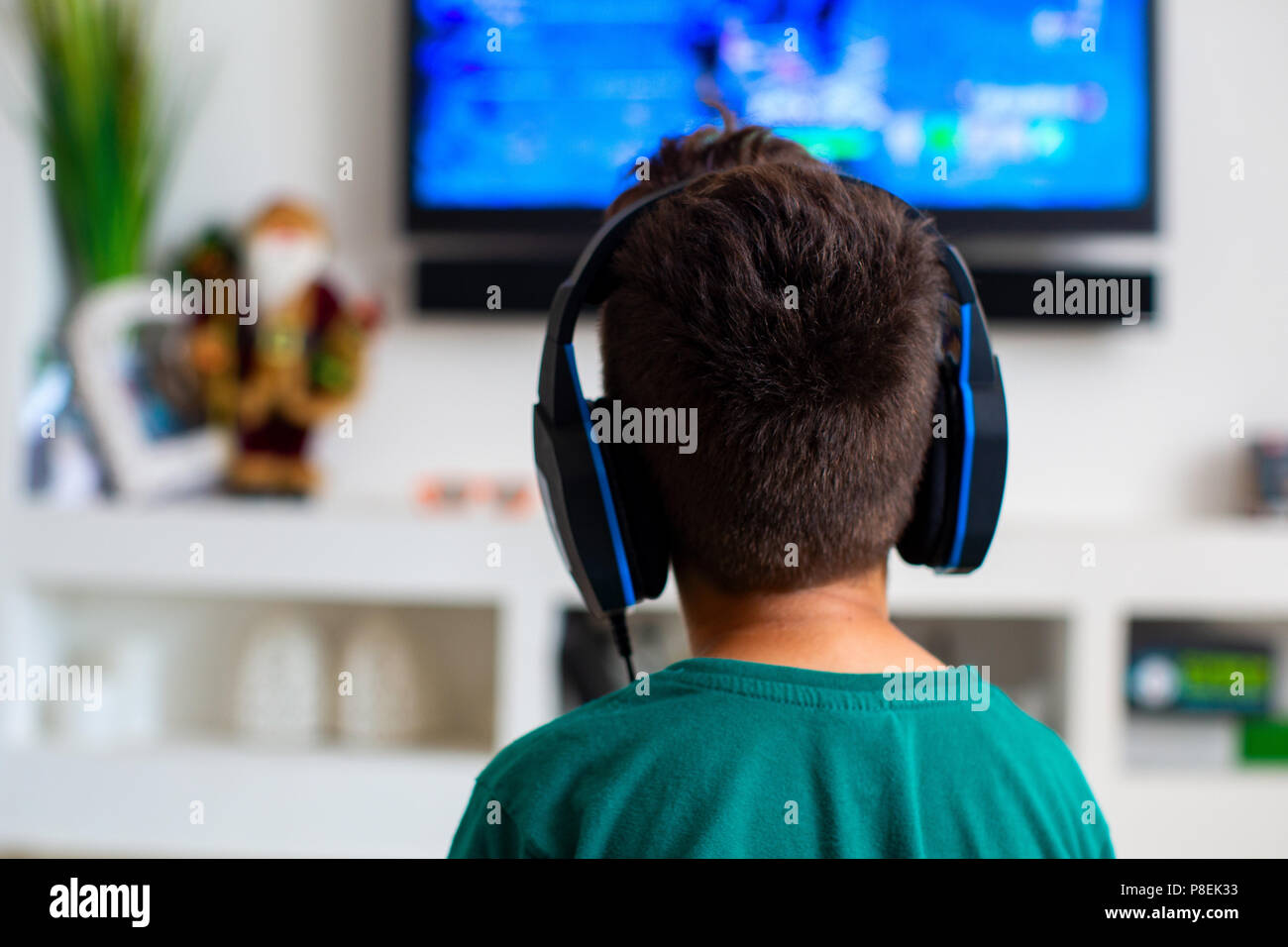 Boy is playing a computer game at home Stock Photo - Alamy