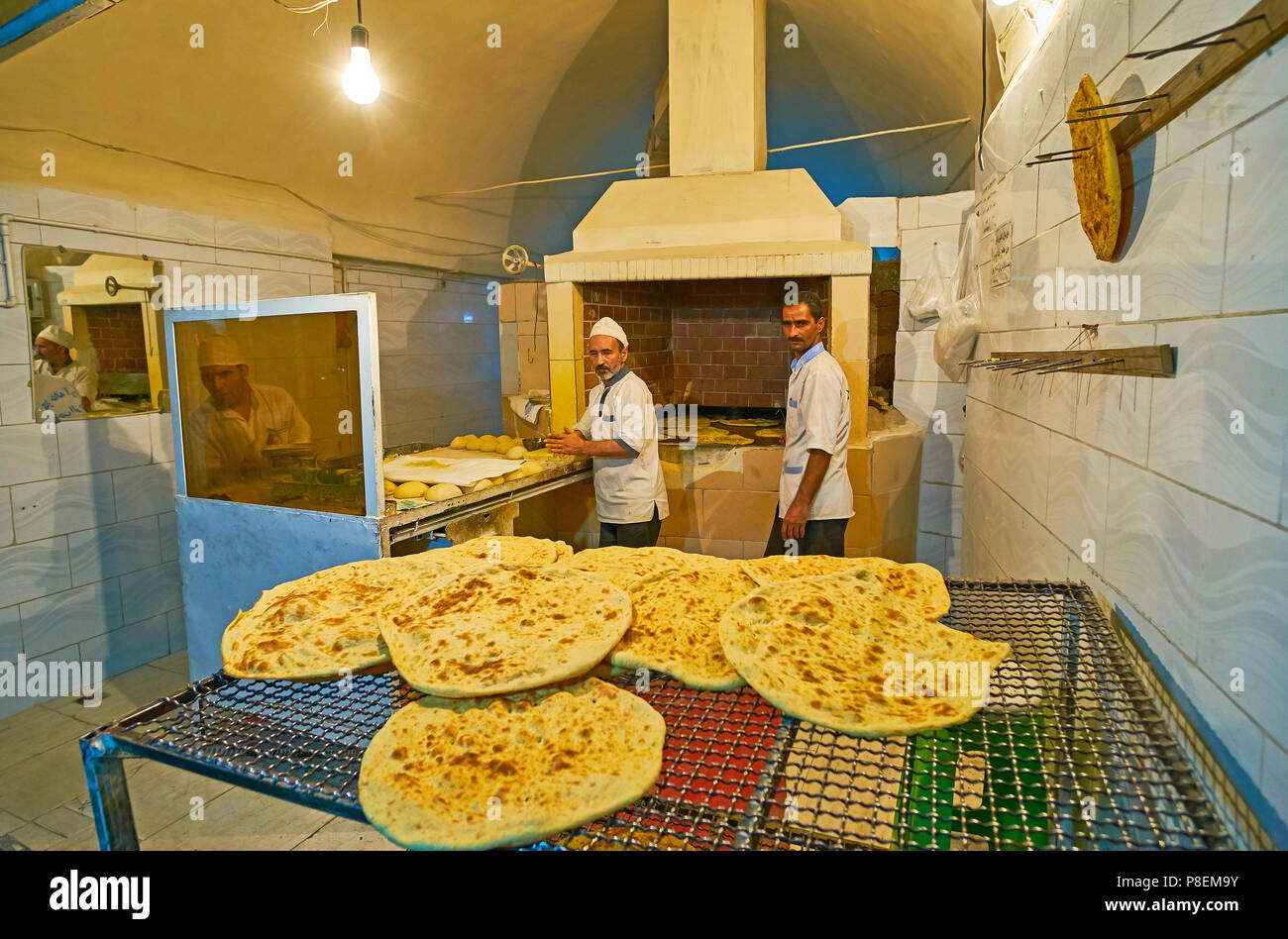 KERMAN, IRAN - OCTOBER 15, 2017: The bakers make traditional tasty ...
