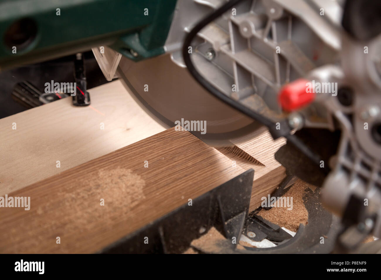 Close up carpenter work with circular saw for cutting boards, the man ...