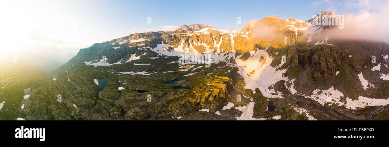 High altitude alpine landscape with majestic rocky mountain peaks ...