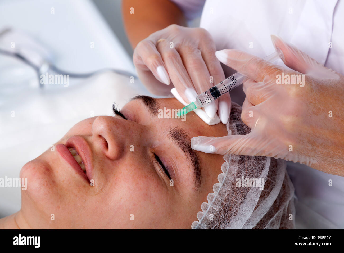 Beautician making injection in woman's face, closeup. Biorevitalization ...