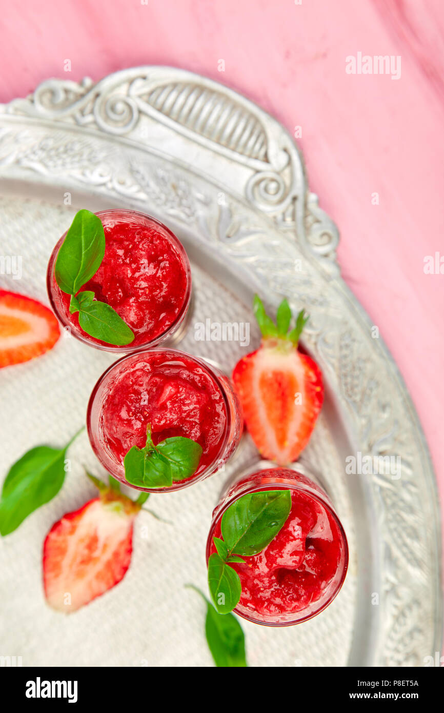Summer refreshing strawberry sorbet, slush granita drink in serving ...