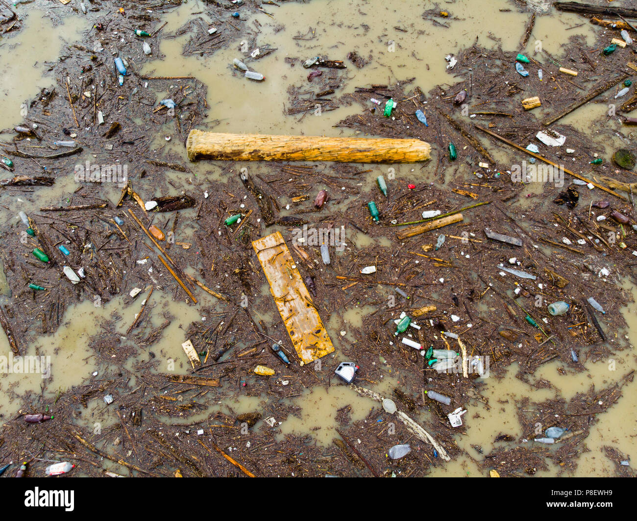 lake water pollution with plastic bags and dirt Stock Photo - Alamy