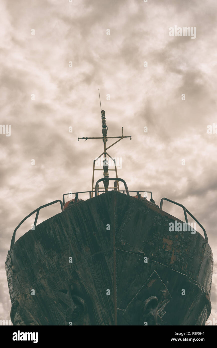 Fisherman's metal trawler with a mast and anchors in the background of ...