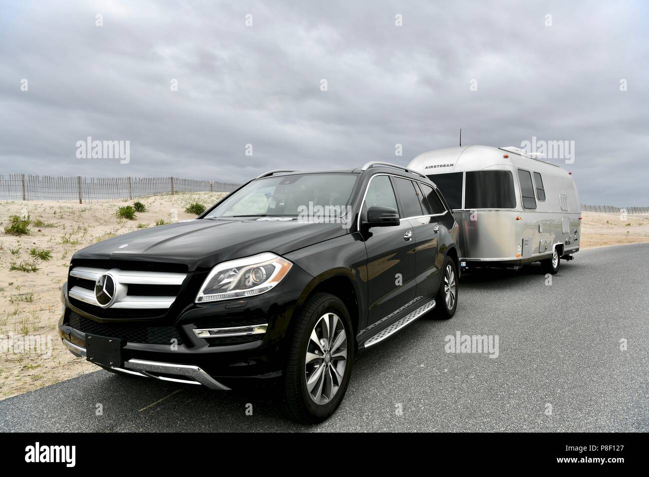 Black Mercedes Benz GL450 towing an Airstream Sport 22FB travel trailer ...