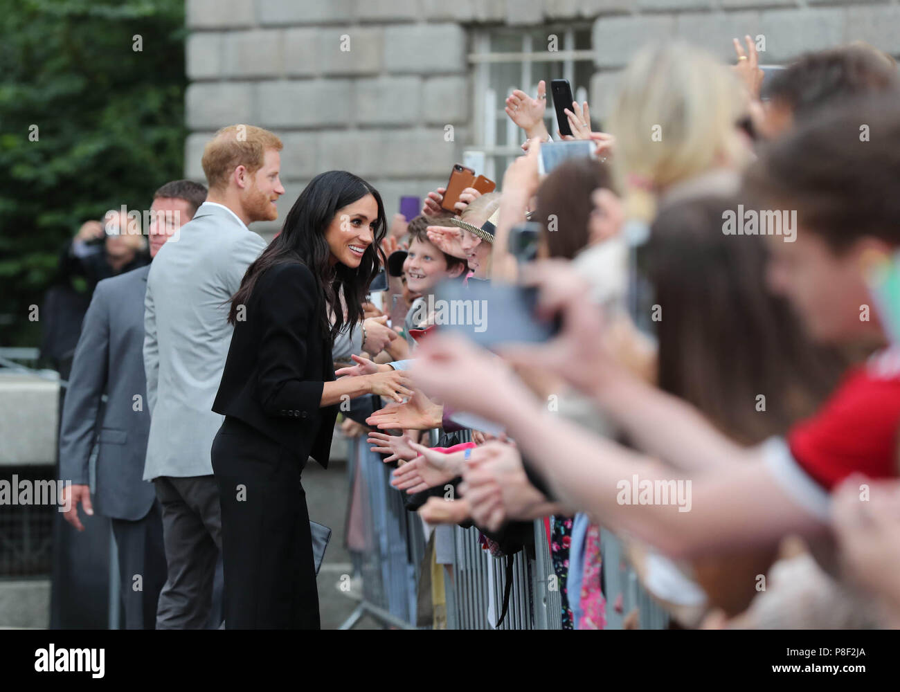 The Duke and Duchess of Sussex on a walkabout at Trinity College during ...