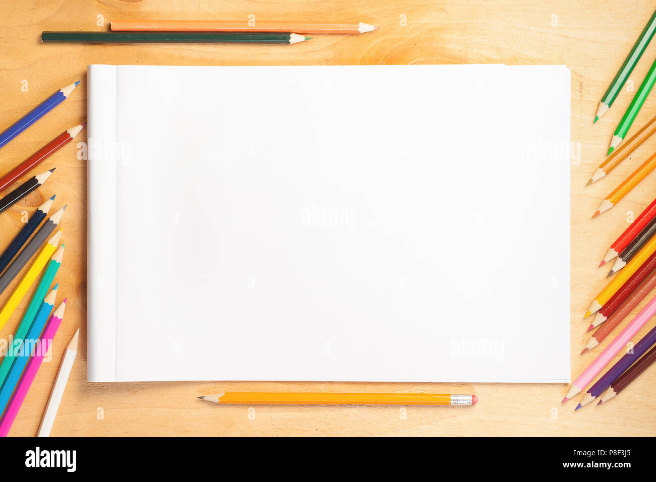 An empty sheet of sketchbook or album for drawing on wooden background ...