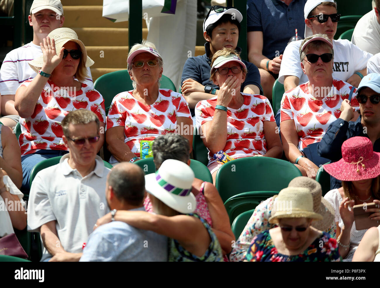 Spectators wearing strawberry themed t shirts on day nine of the ...