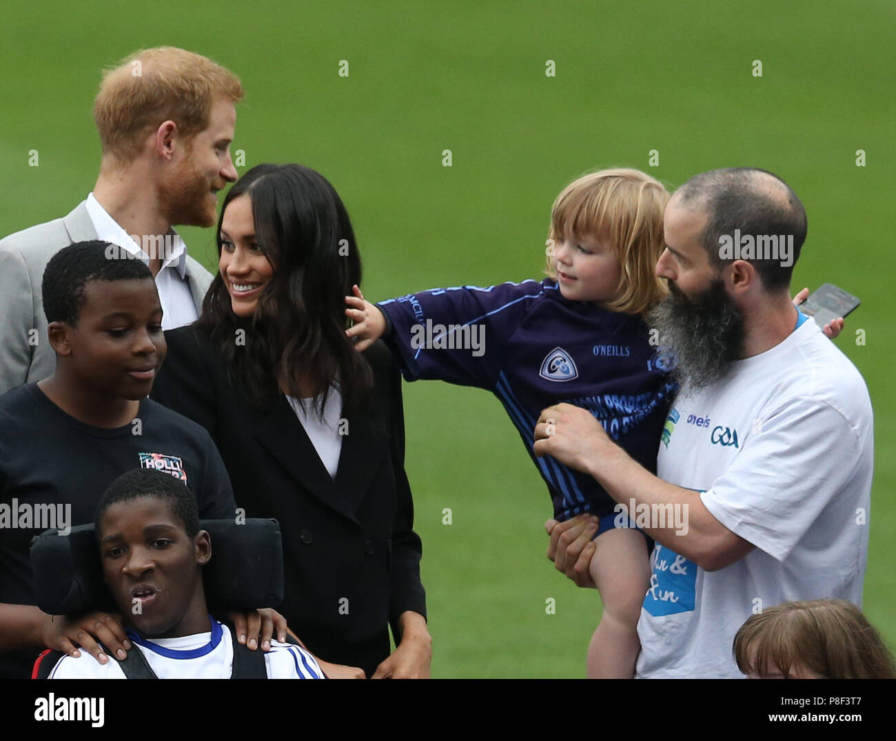 Walter Cullen, 3, reaches out to touch the Duchess of Sussex's hair ...