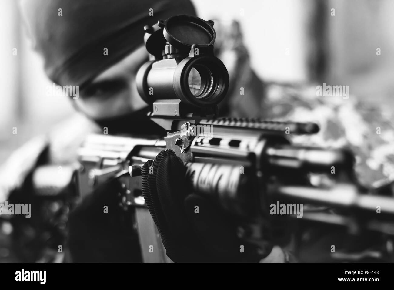 man aiming with an AK-47 with reflex sight Stock Photo - Alamy