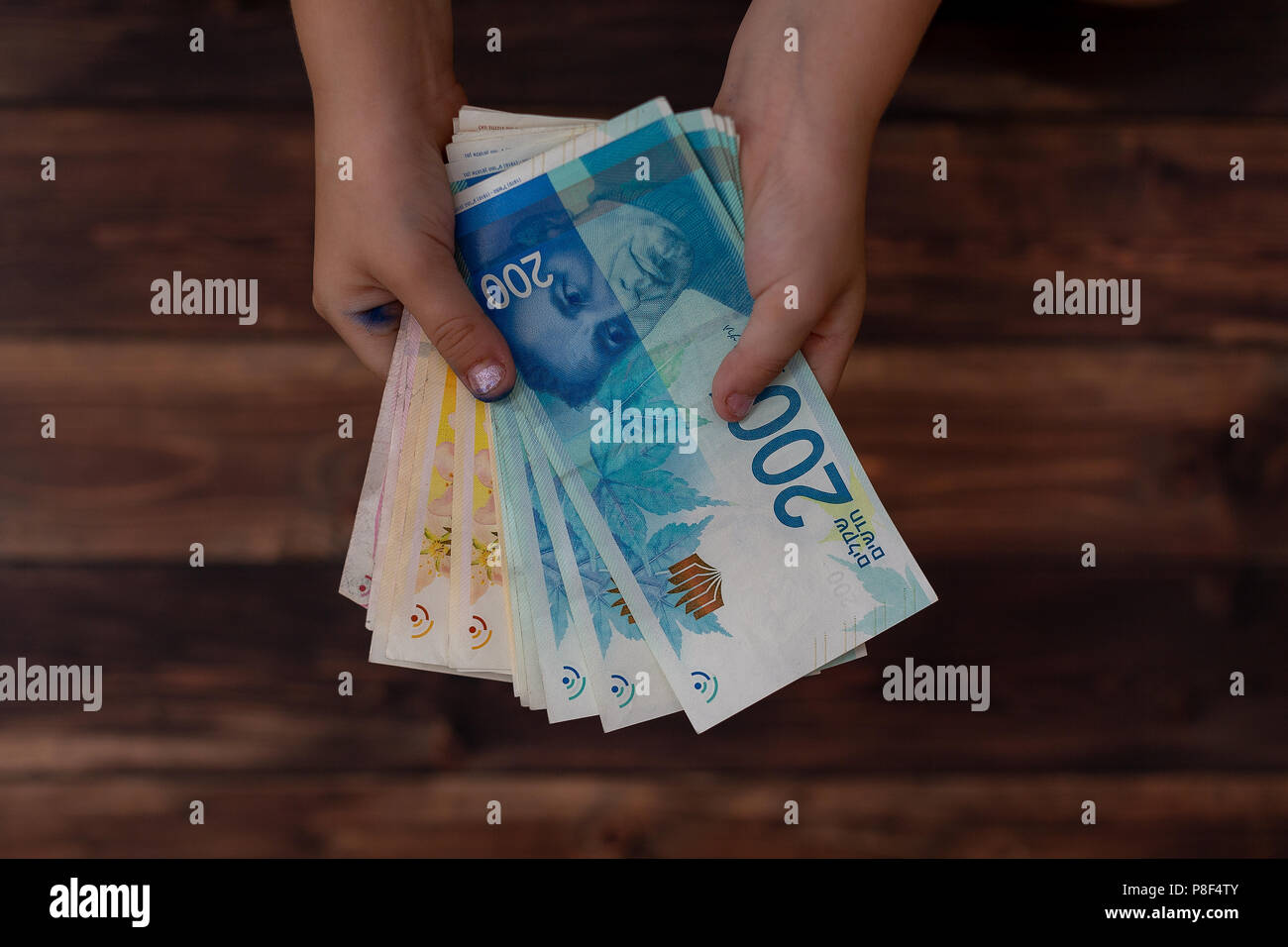 Girl counting money at bank hi-res stock photography and images - Alamy