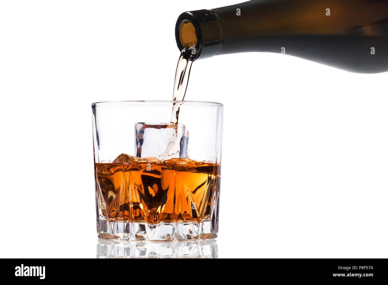 Pouring Cold Whiskey Into The Glass Isolated On White Background Stock ...