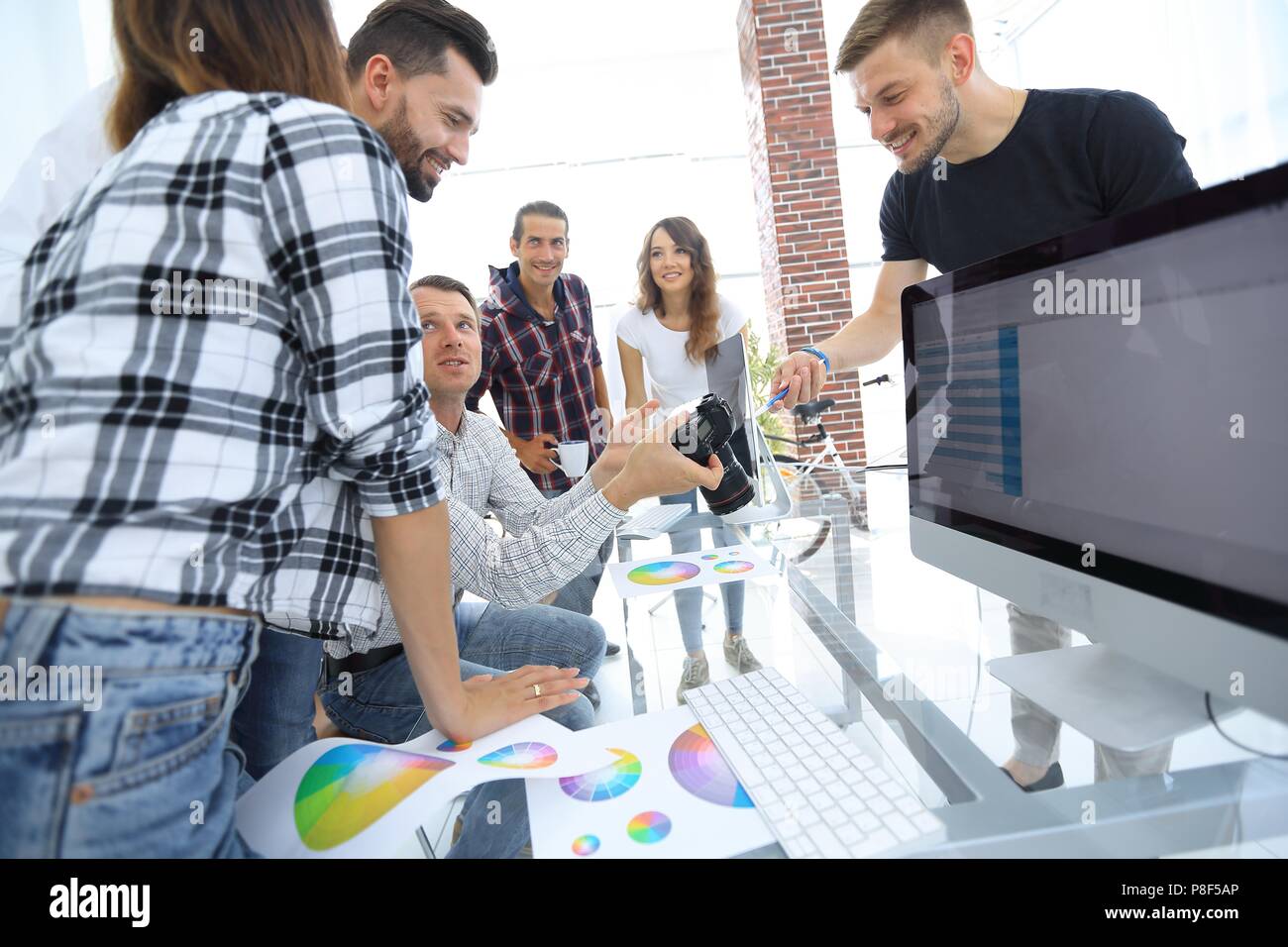 Cheerful photo editors working hi-res stock photography and images - Alamy
