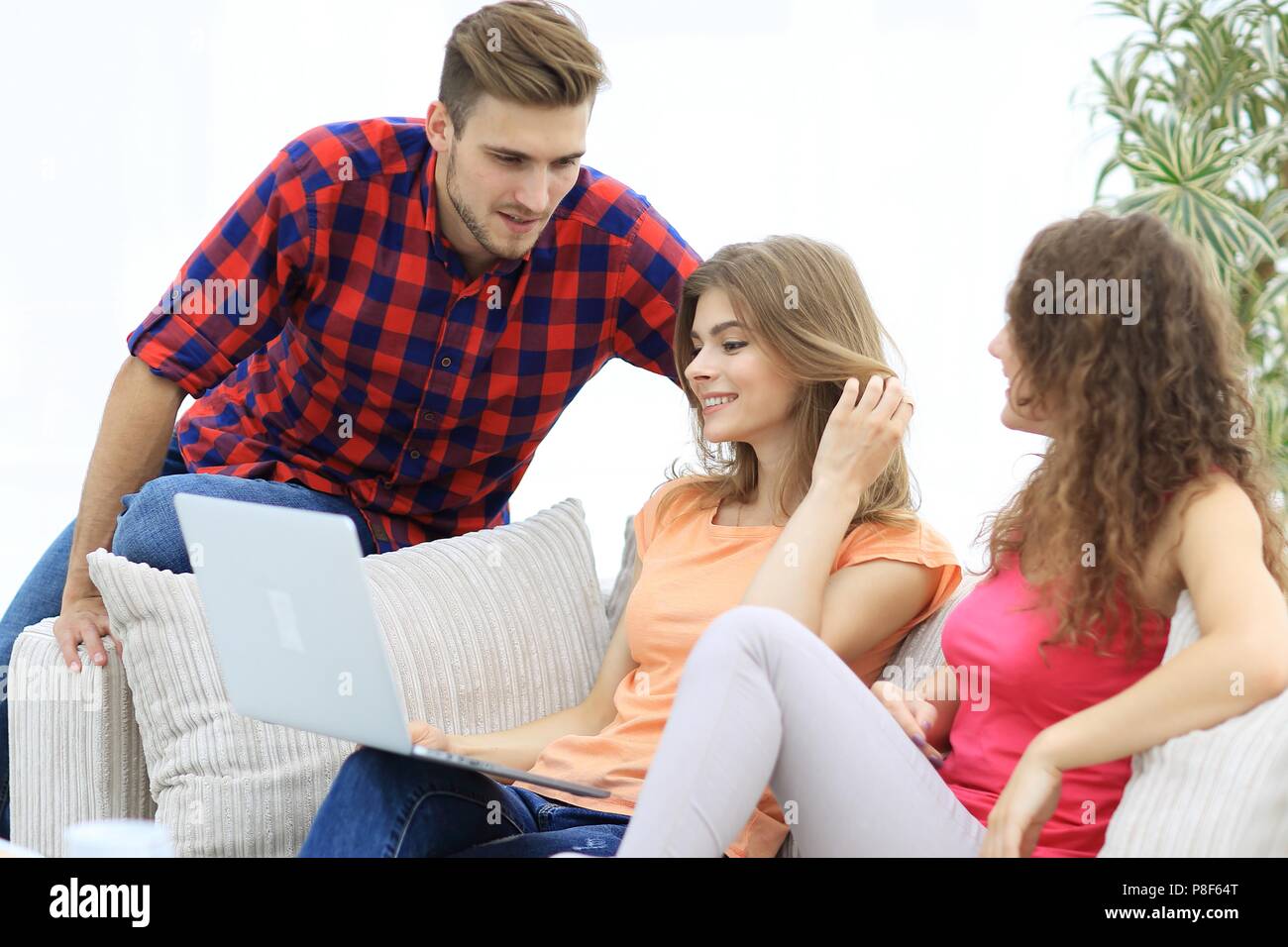 young people talking in the living room Stock Photo - Alamy