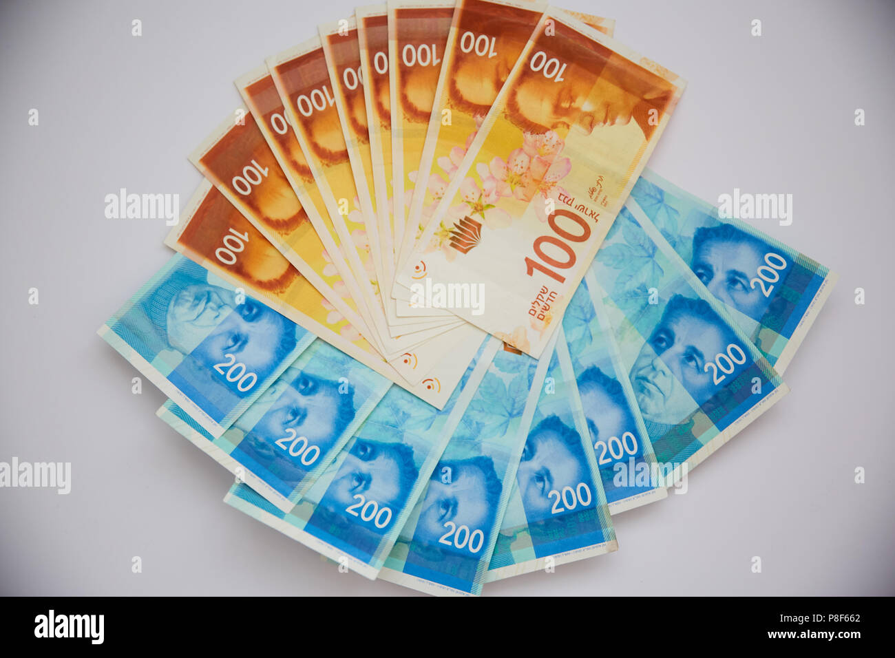 Stack of hundred sheqalim isolated on white background Stock Photo - Alamy