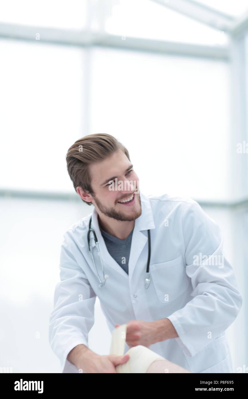 doctor removing the bandages from the patient's foot Stock Photo - Alamy