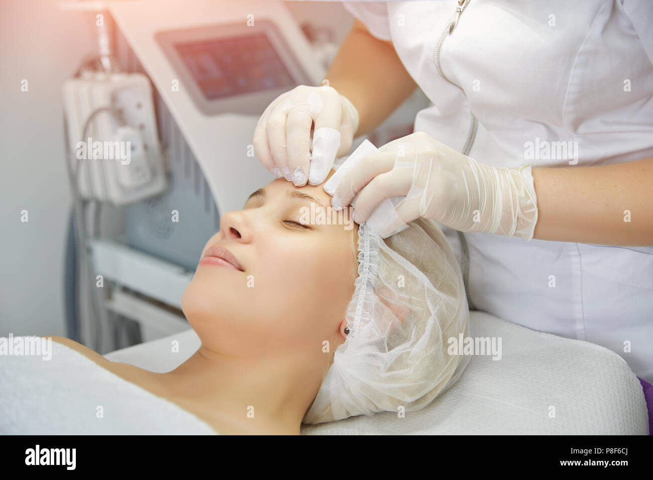 Woman removing mask cosmetic hi-res stock photography and images - Alamy