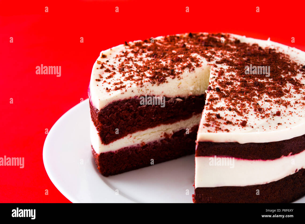Red Velvet cake on red background Stock Photo - Alamy
