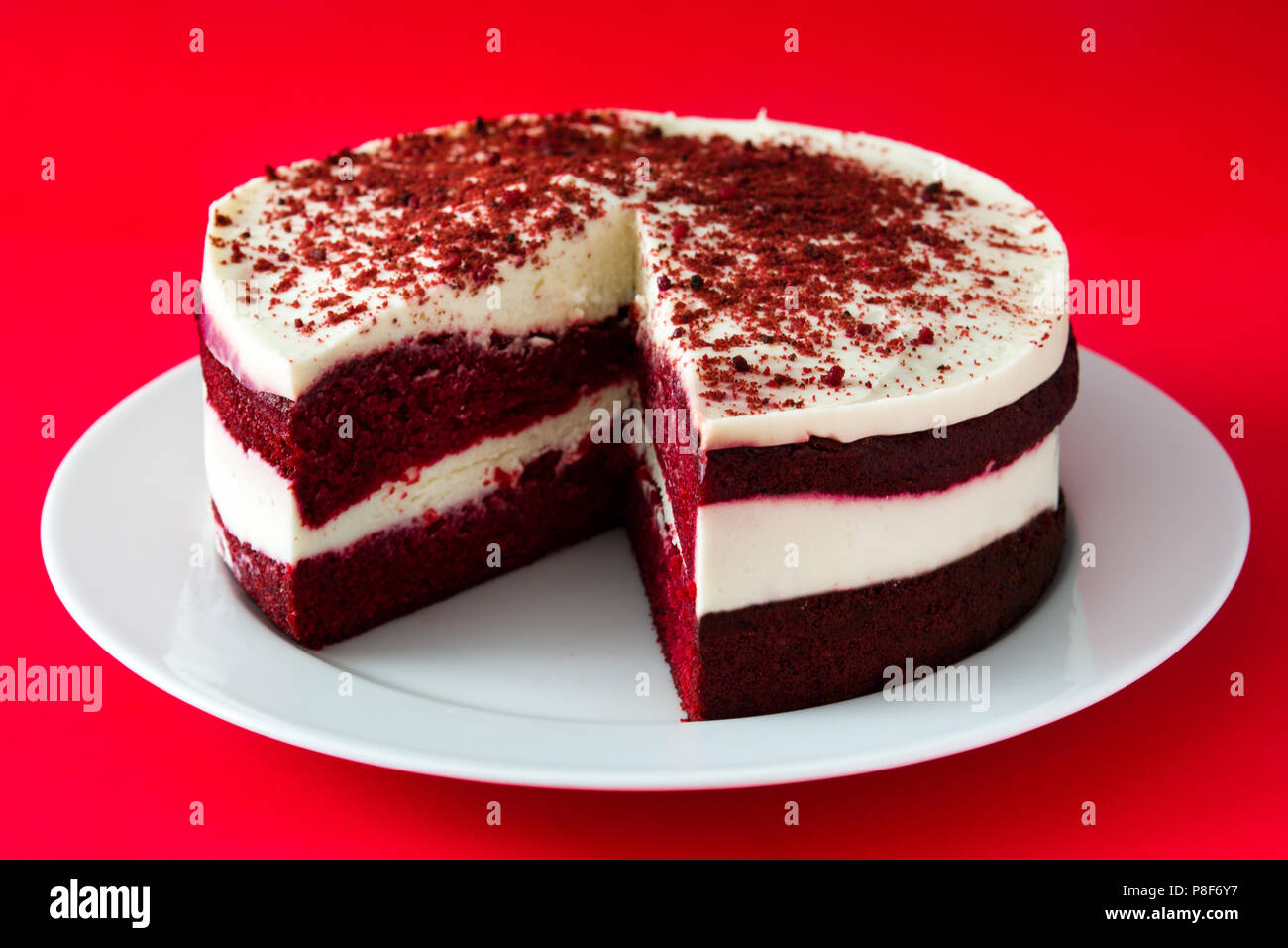 Red Velvet cake on red background Stock Photo - Alamy
