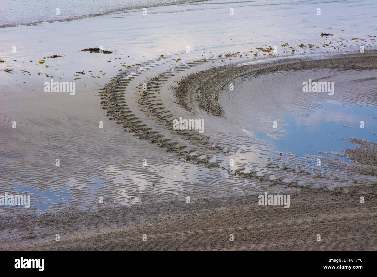 Sand tracks made by people and machinery Stock Photo - Alamy