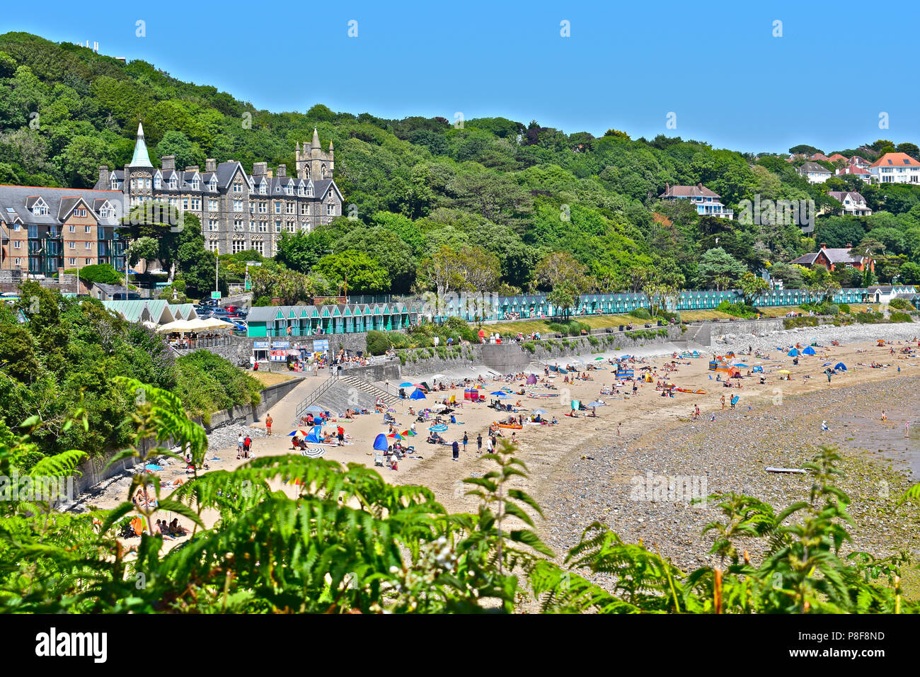People enjoying the summer sunshine on the beach at Langland Bay, Gower ...