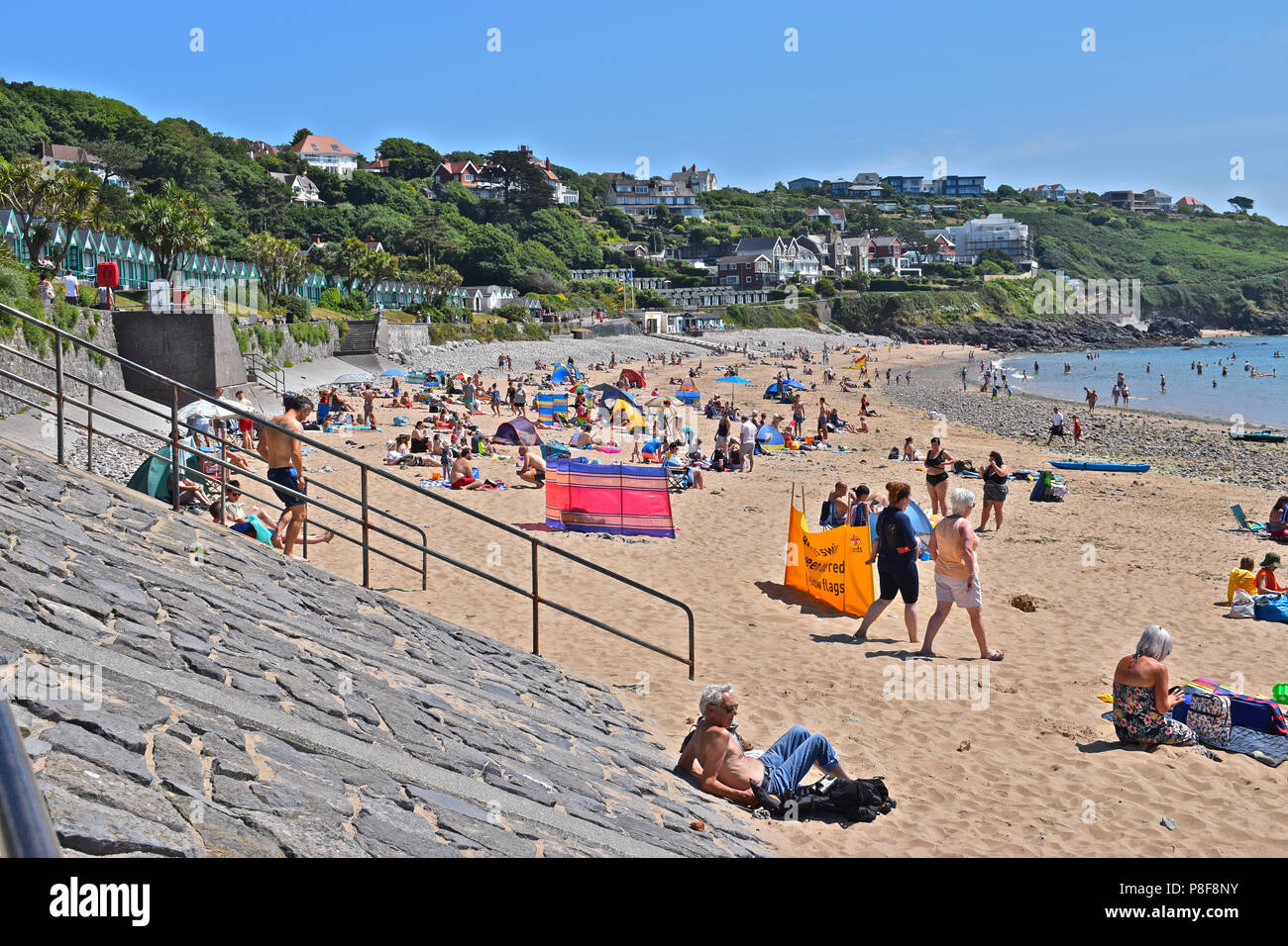 People enjoying the summer sunshine on the beach at Langland Bay, Gower ...