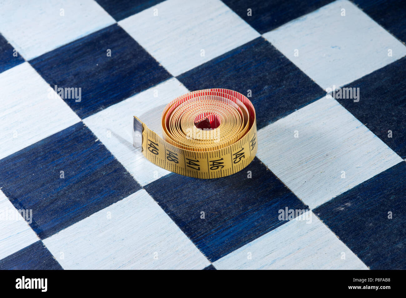 a scroll meter on chess board Stock Photo - Alamy