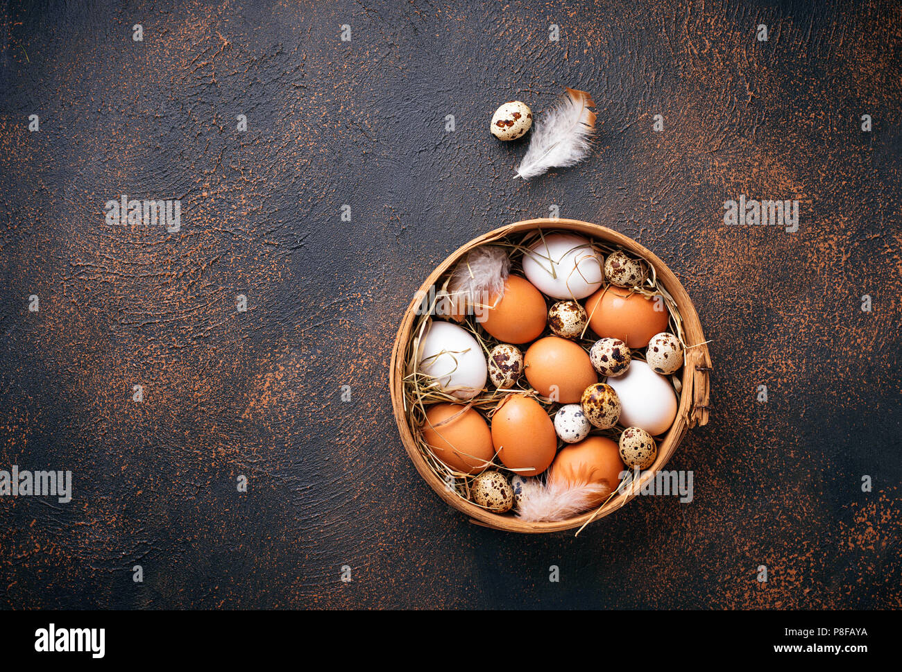 Fresh raw chicken and quail eggs in sieve Stock Photo - Alamy