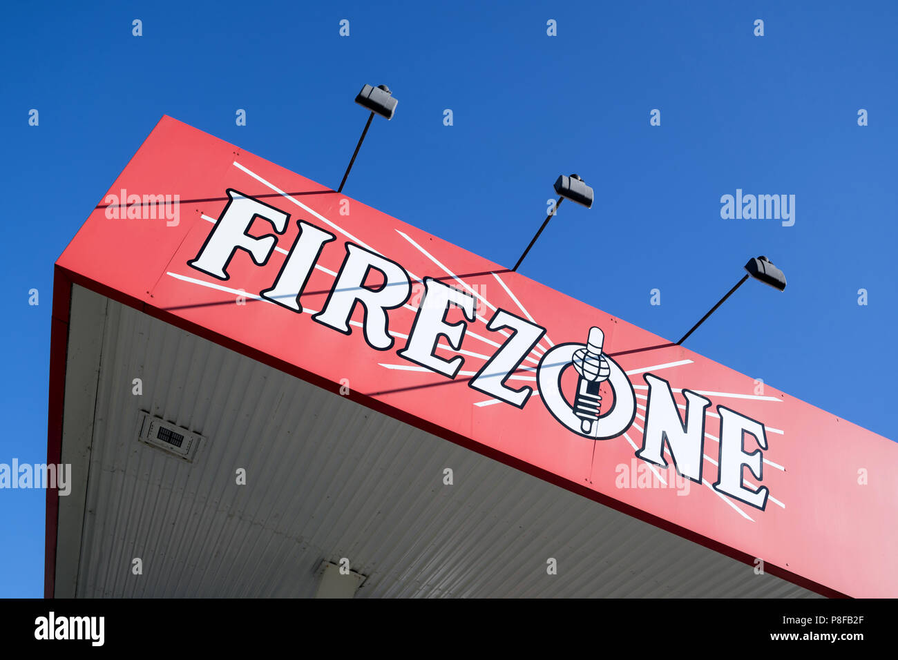 Firezone sign at gas station. Firezone operates a network of automatic ...