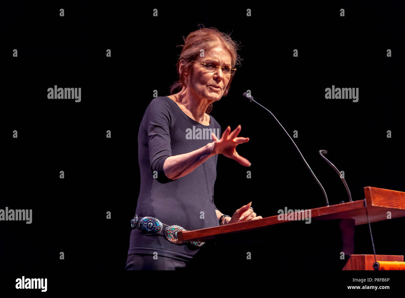 Gloria Steinem stands at a podium giving a lecture Stock Photo - Alamy