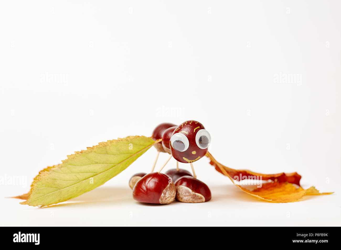 Chestnut figure made of chestnuts and leaves make autumn Stock Photo ...