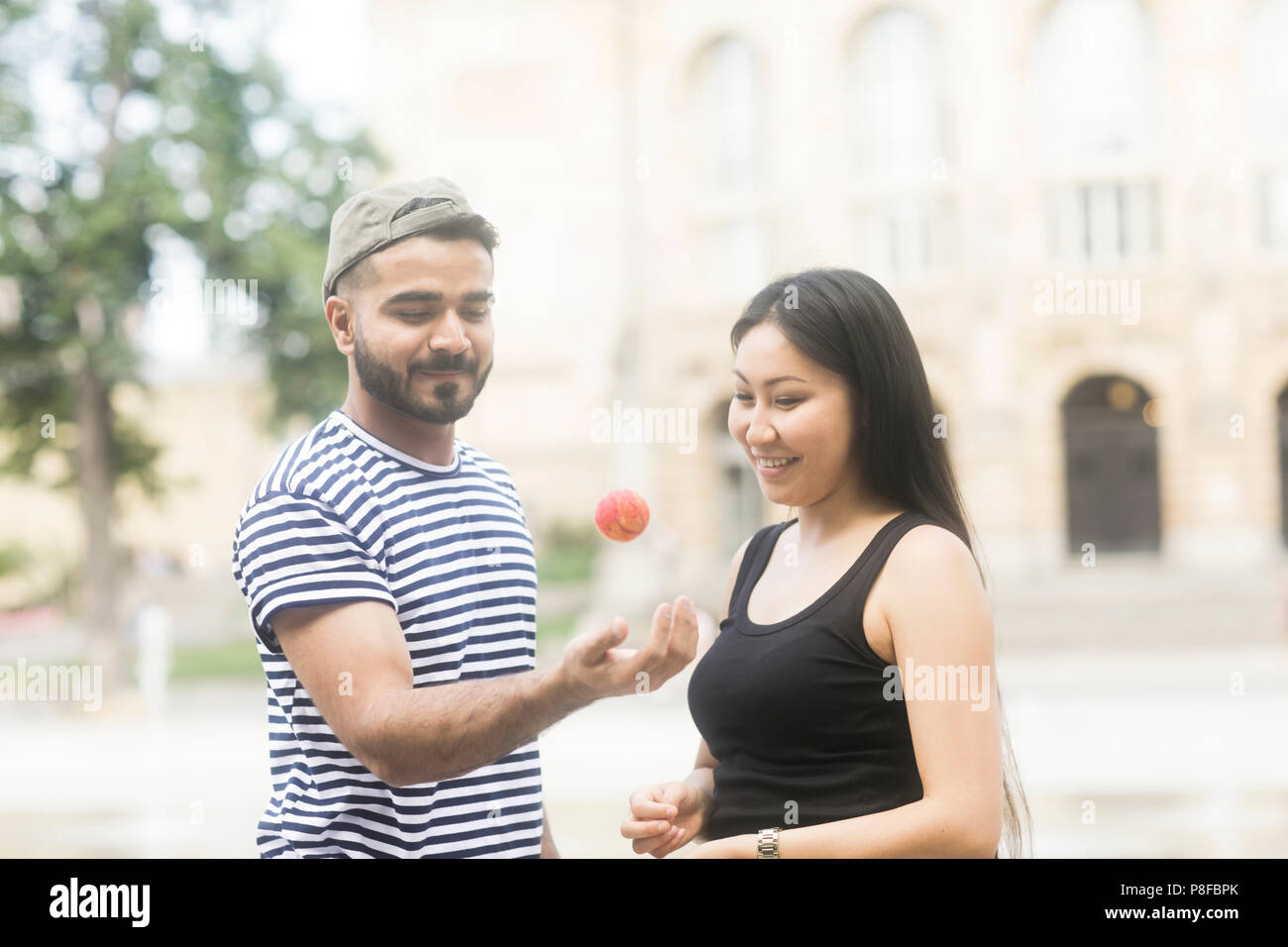 Cheerful friends playing ball hi-res stock photography and images - Alamy