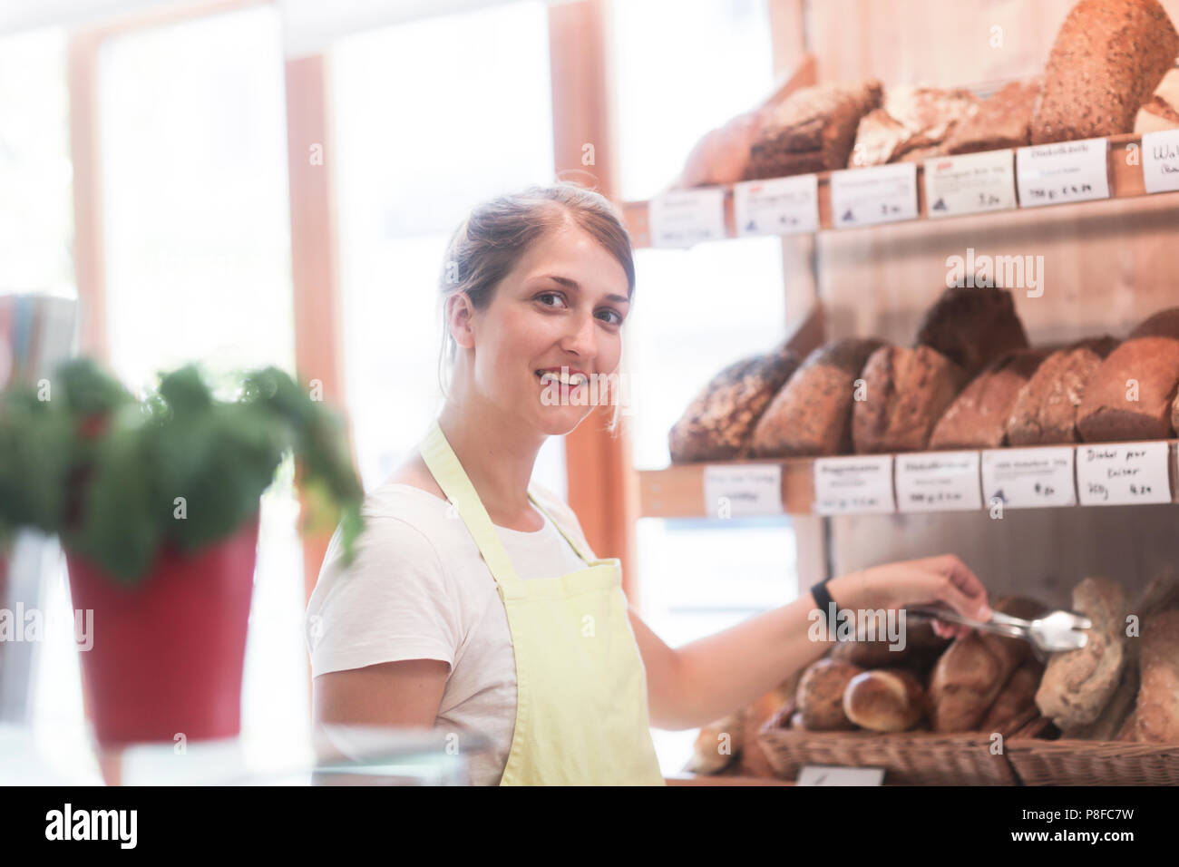 Young baker assistant hi-res stock photography and images - Alamy
