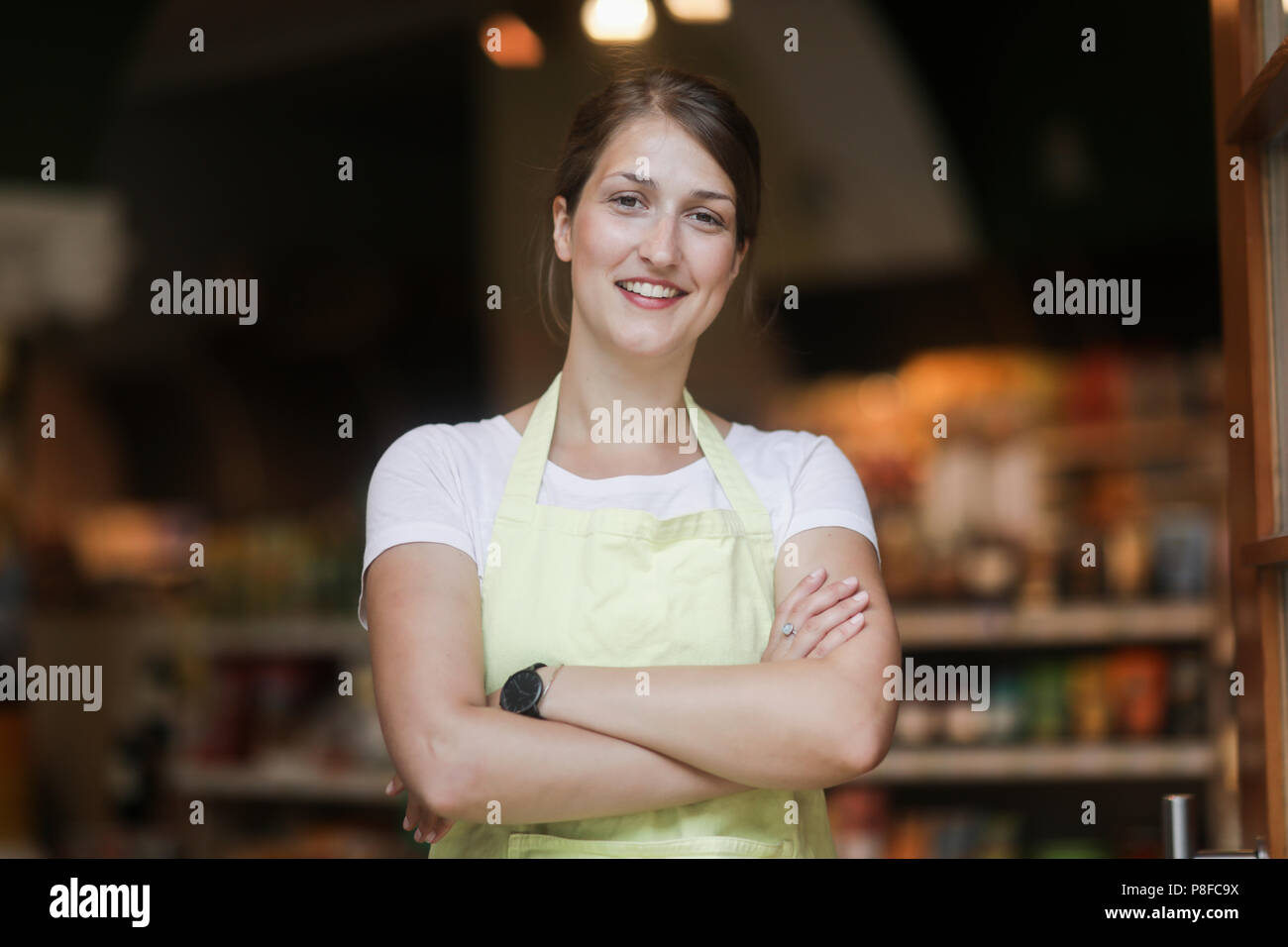 Smiling shop assistant arms hi-res stock photography and images - Alamy