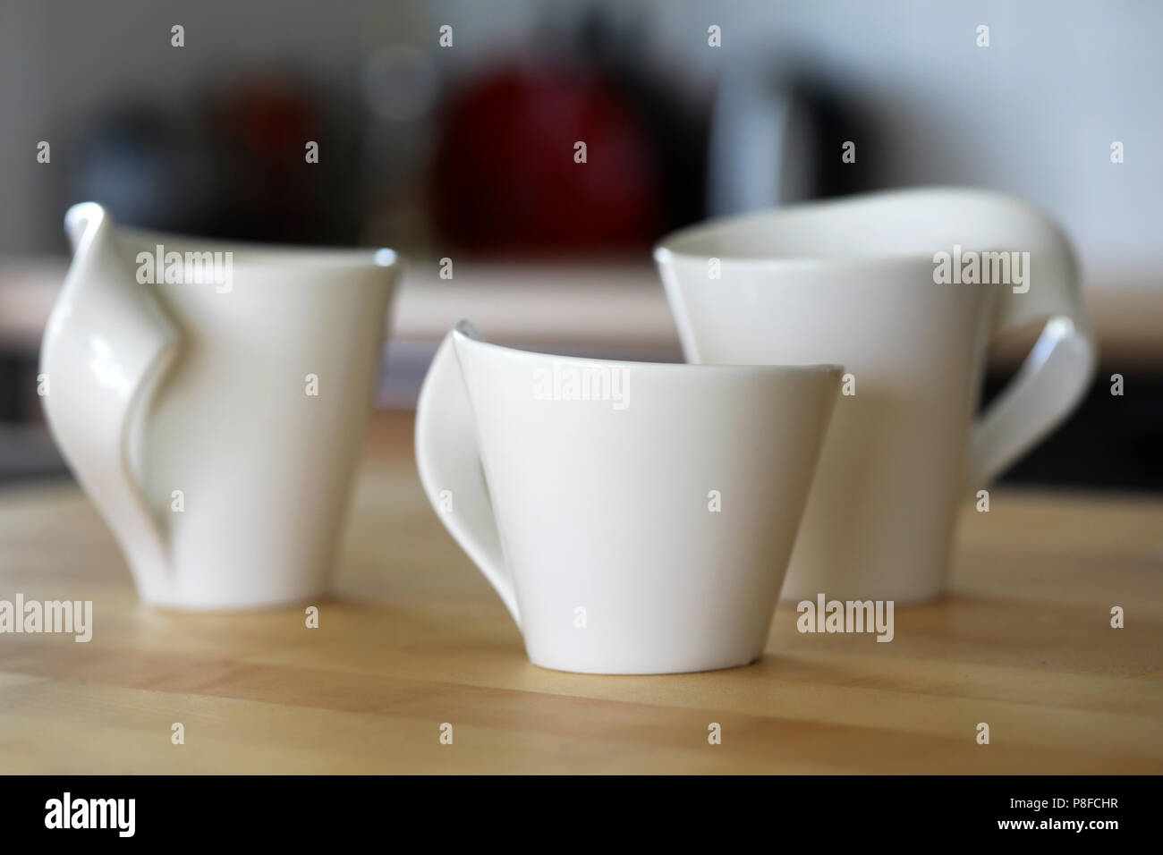 Three cups on a table Stock Photo - Alamy