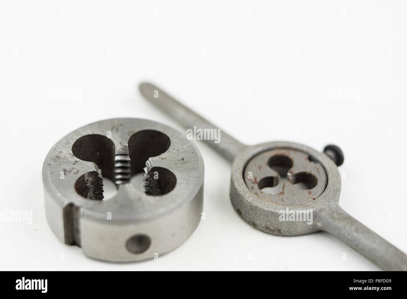 Device for making threads in a screw. Metalworking accessories. White ...