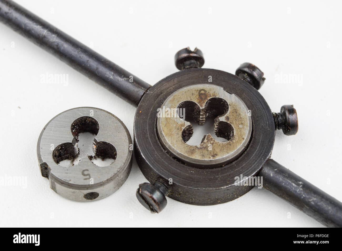 Device for making threads in a screw. Metalworking accessories. White ...