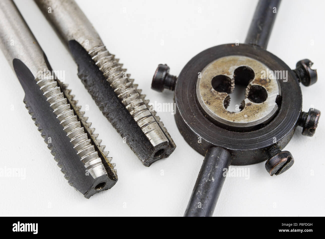 Device for making threads in a screw. Metalworking accessories. White ...