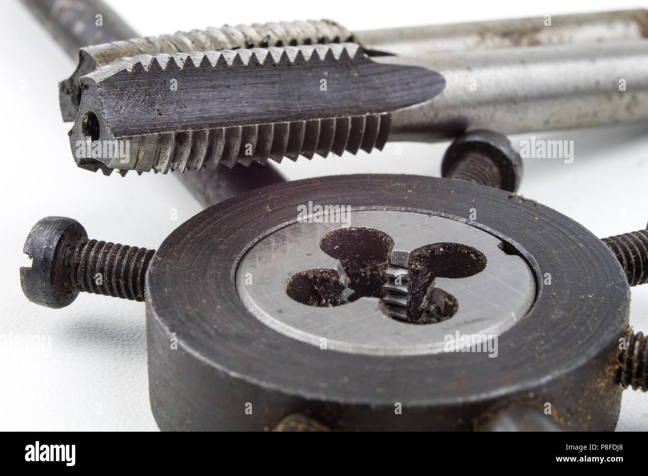 Device for making threads in a screw. Metalworking accessories. White ...