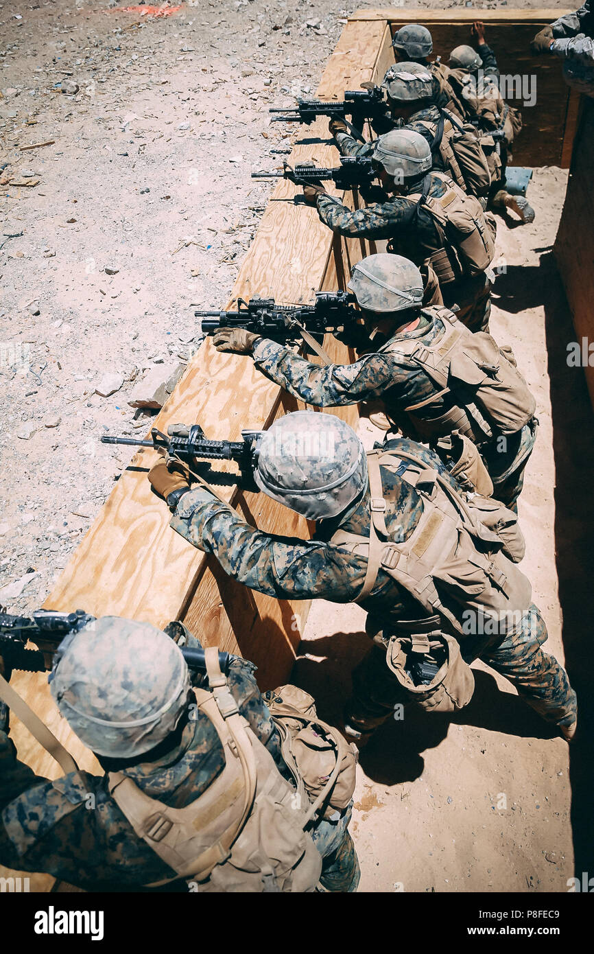 Marines in the Infantry Officer Course fire at the second enemy trench ...