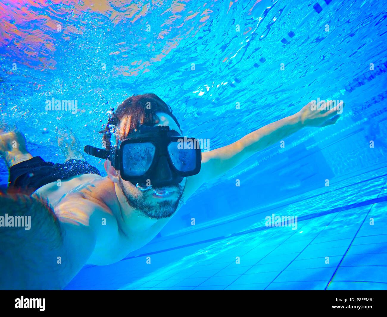 Refreshing at pool. Underwater wide angle selfie shot Stock Photo - Alamy