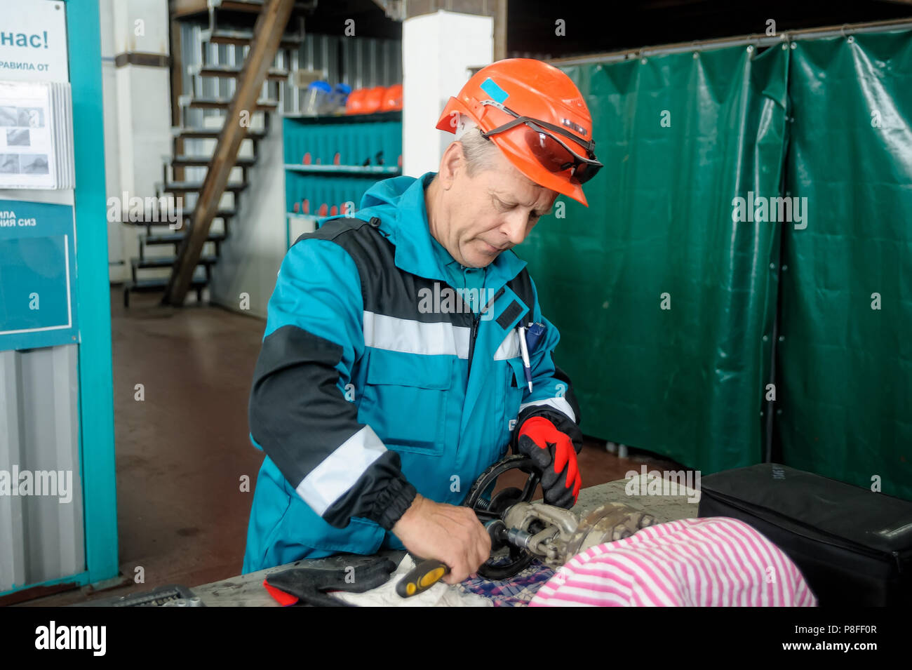 Mechanics carry out adjusting in the workshop Stock Photo - Alamy
