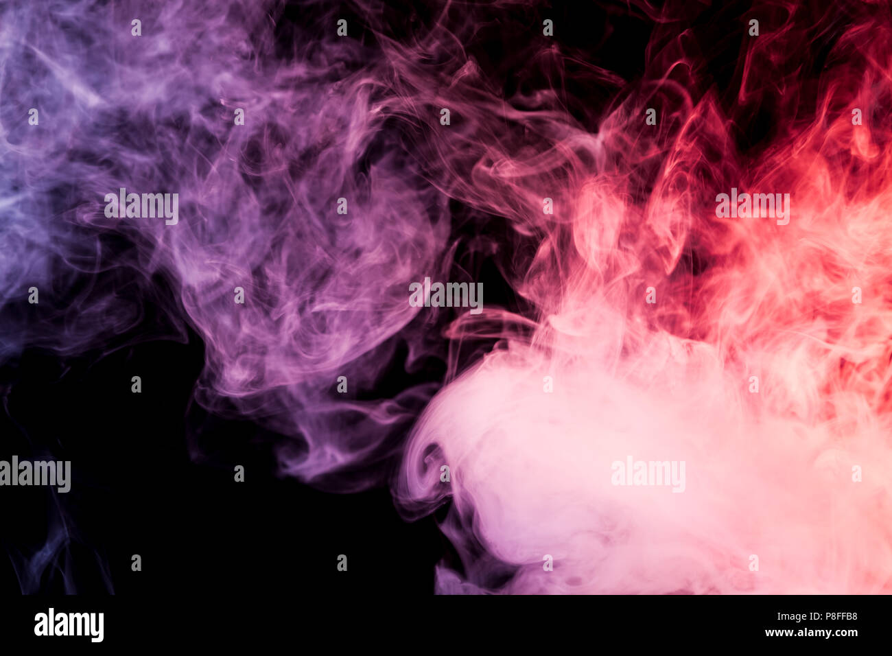 Colorful pink and red smoke on a black isolated background. Background ...