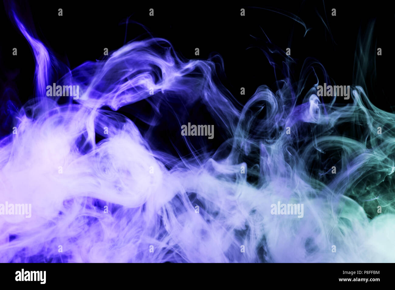 Colorful blue smoke on a black isolated background. Background from the ...