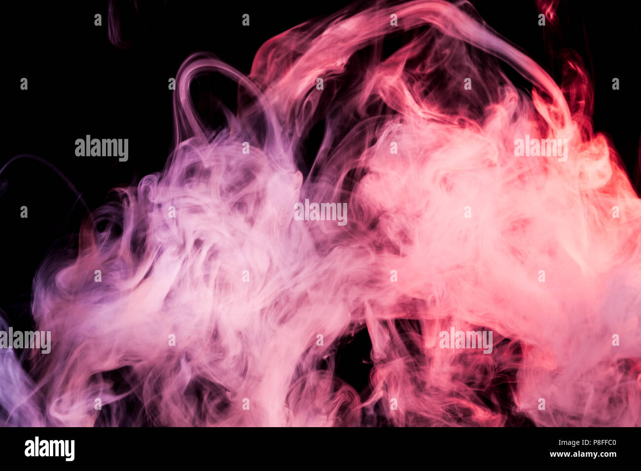 Colorful pink and red smoke on a black isolated background. Background ...
