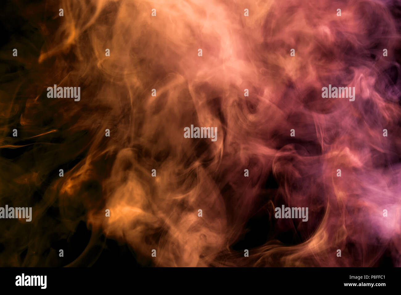 Colorful pink and red smoke on a black isolated background. Background ...