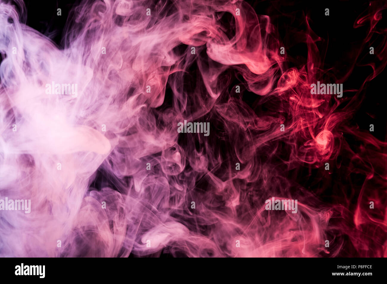 Colorful pink and red smoke on a black isolated background. Background ...